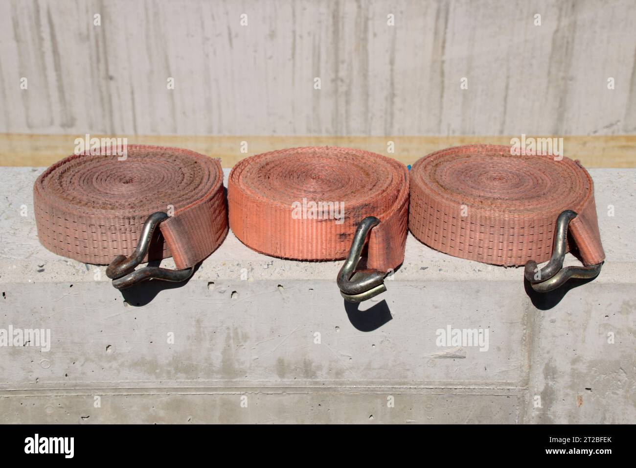Straps for securing loads on a wall Stock Photo - Alamy