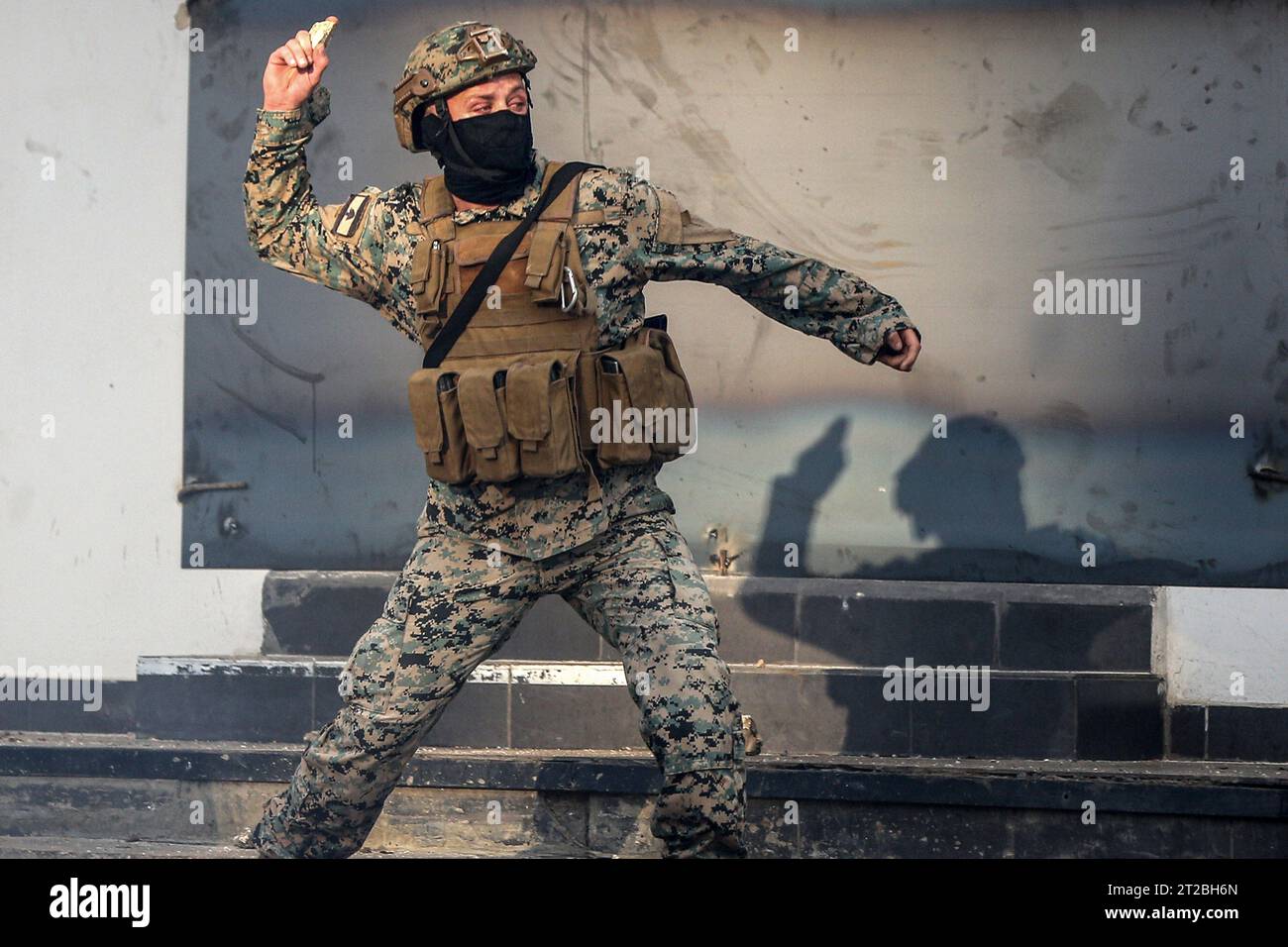 Beit Awkar, Lebanon. 18th Oct, 2023. A Lebanese army soldier throws a ...