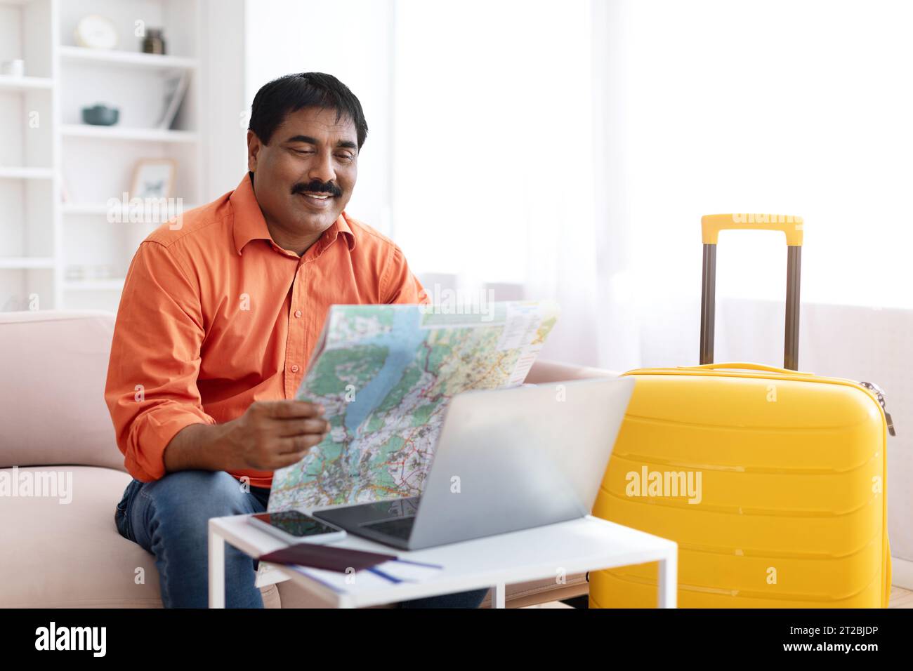 Excited Mature Indian Man Tourist Looking At Paper Map Stock Photo - Alamy