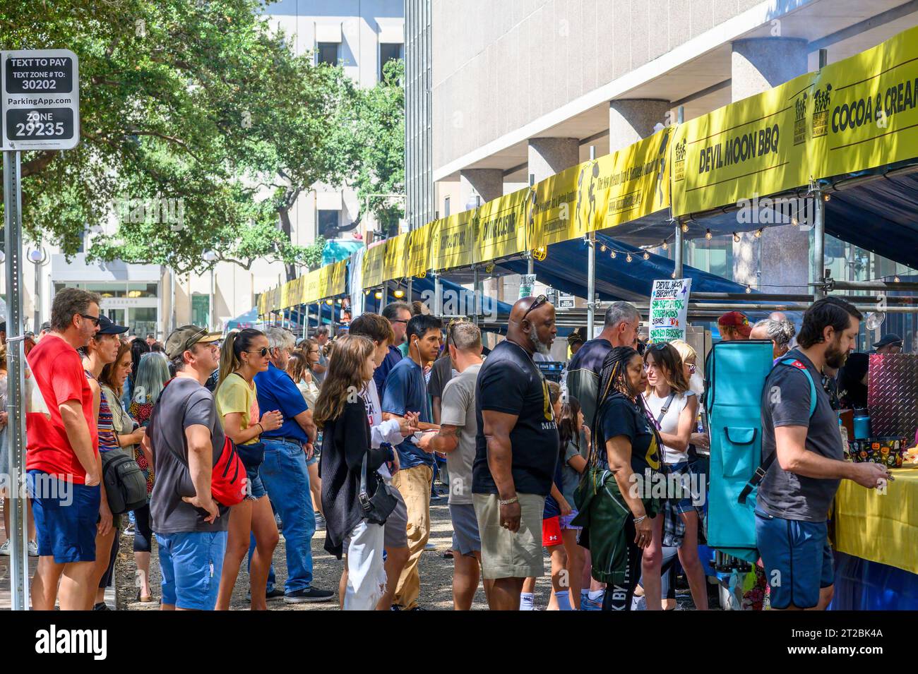 NEW ORLEANS, LA, USA - OCTOBER 14, 2023: Lines at the food booths at the free Crescent City ...