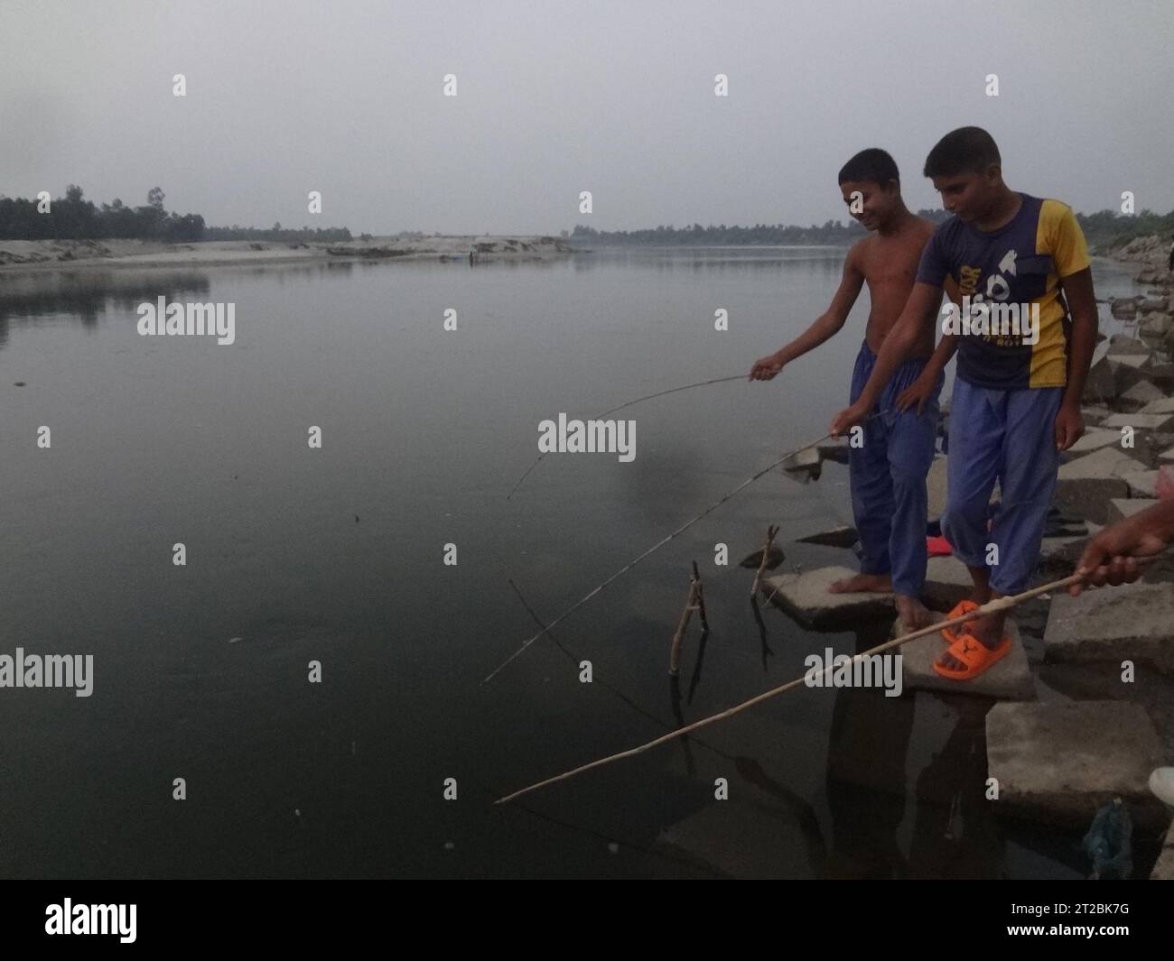 Naogaon, Bangladesh. 18th Oct, 2023. People catch fishs in their ...