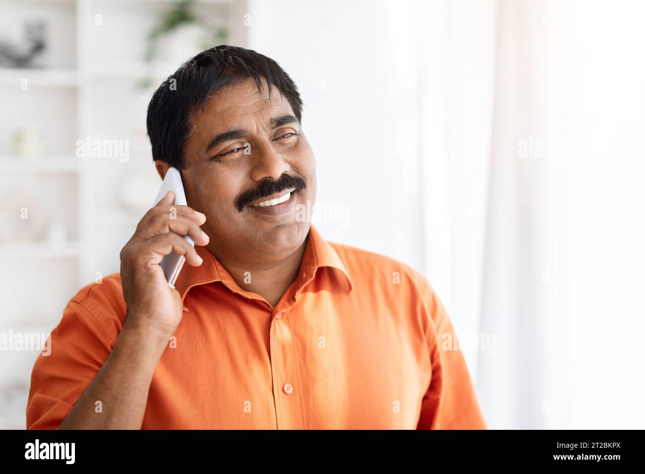 Portrait of cheerful mature indian man have phone conversation Stock ...