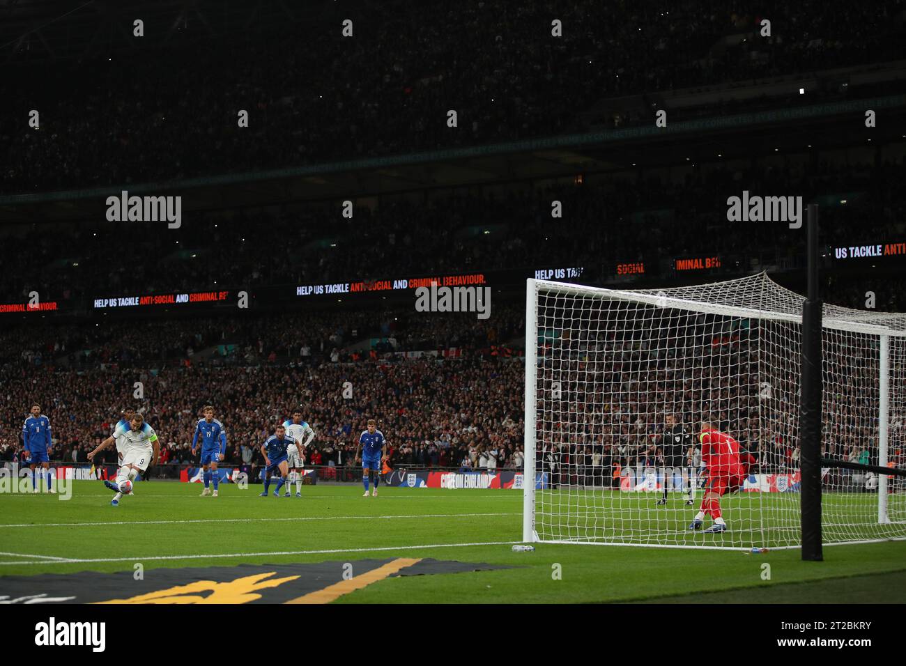 Harry Kane of England scores a goal from a penalty kick to make it 1-1 ...