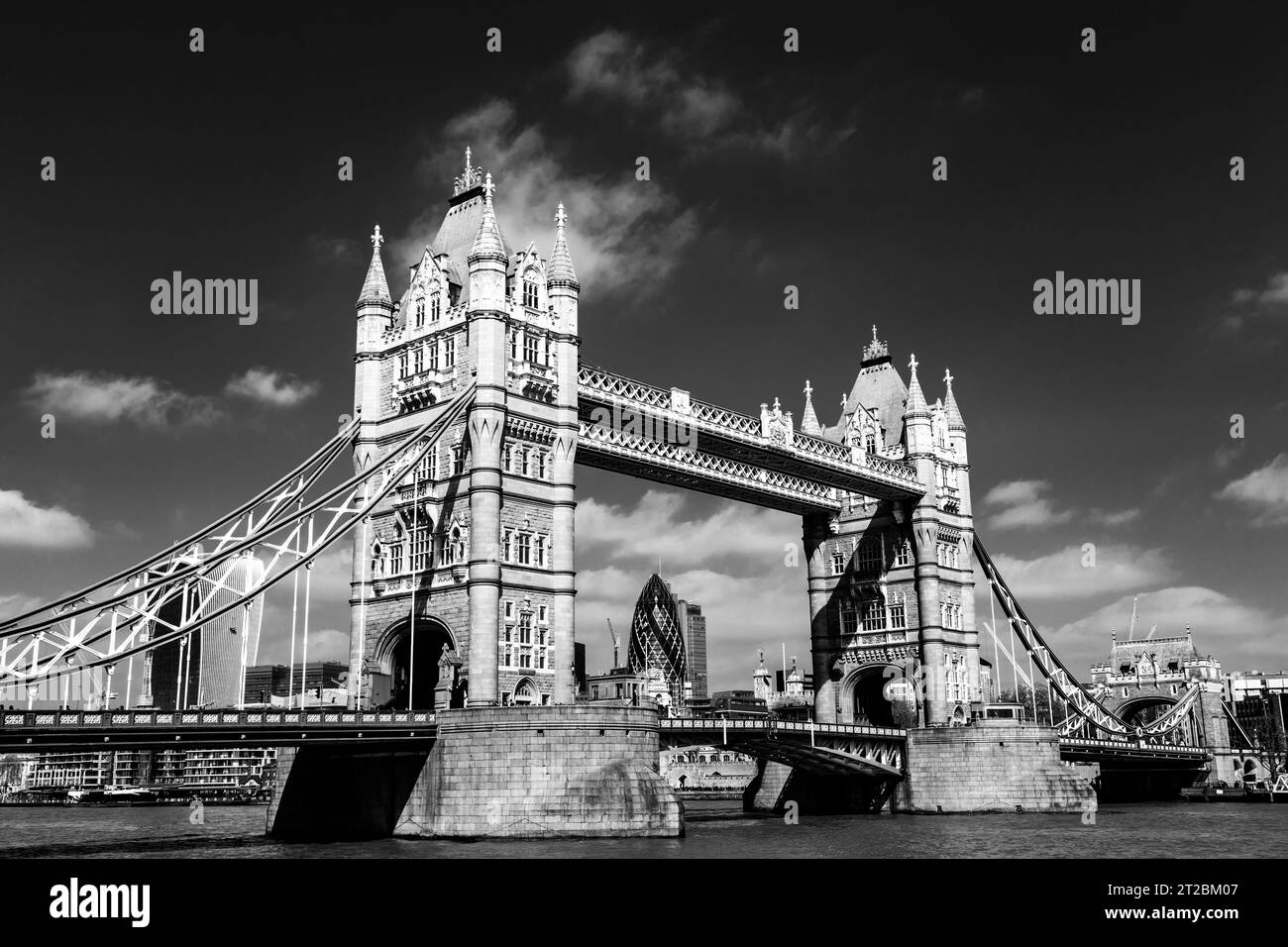 Red traditional double-decker bus driving on Tower Bridge in London, UK ...