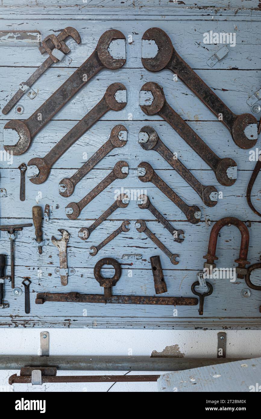 Old shed containing rusty mechanical tools. Vintage old tools with rust ...