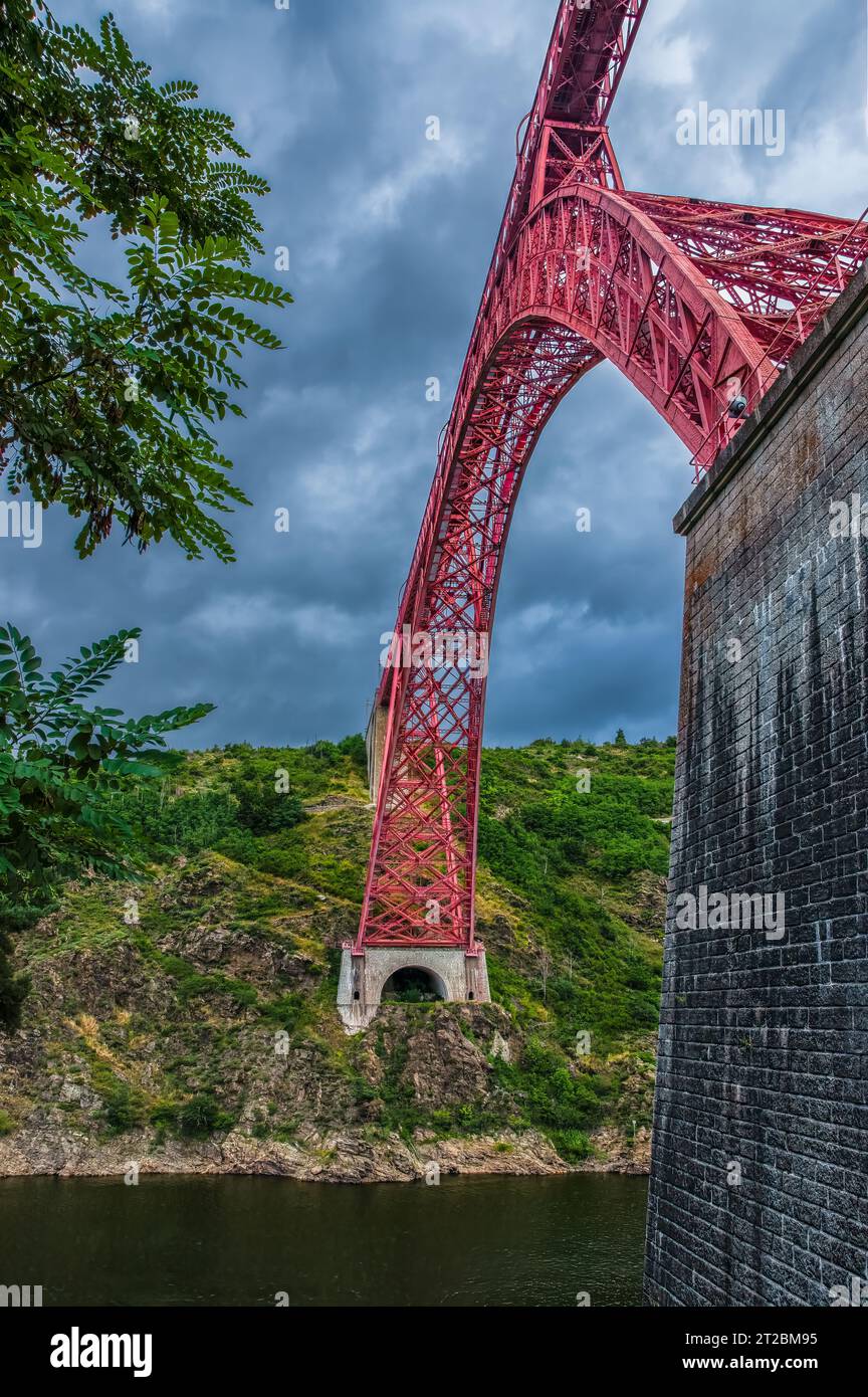 Garabit Viaduct, a red railway arch bridge constructed by Gustave ...