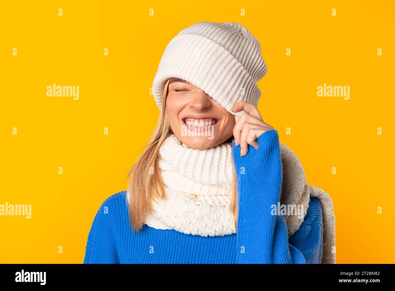 Woman pulling sweater over face hi-res stock photography and images - Alamy