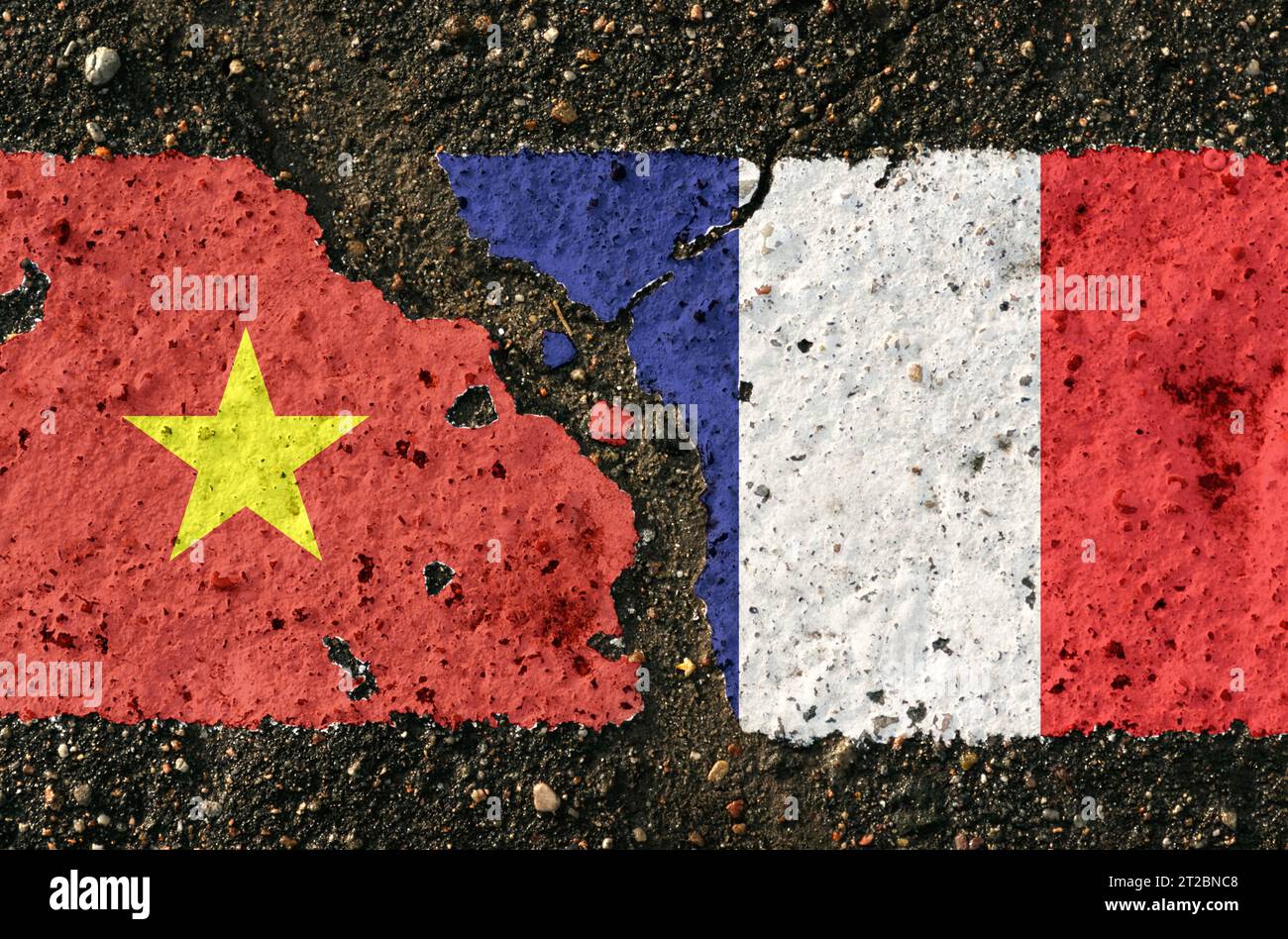 On the pavement are images of the flags of Vietnam and France, as a ...