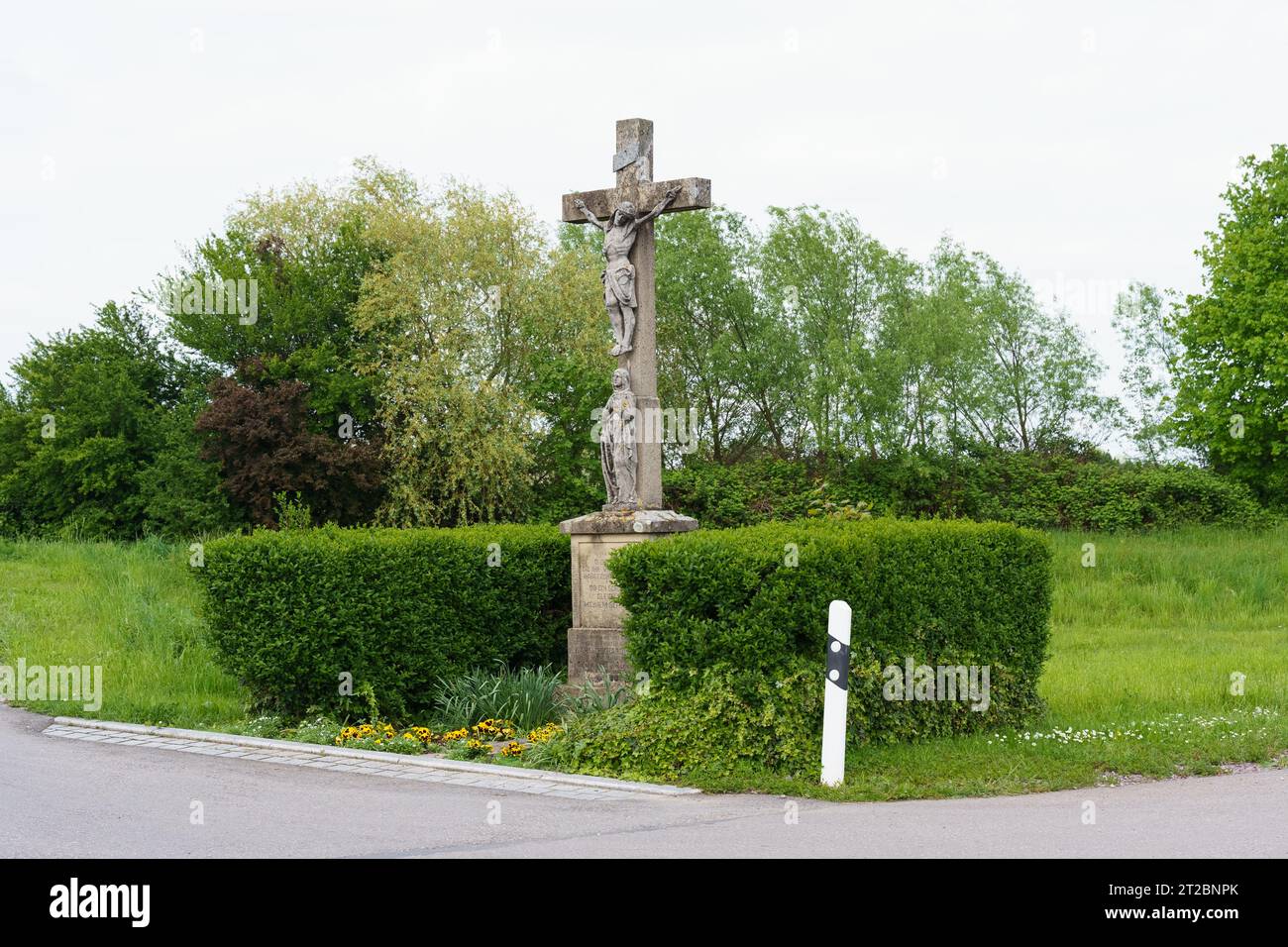 The Jesus Cross near the road at the entrance to a German village Stock ...