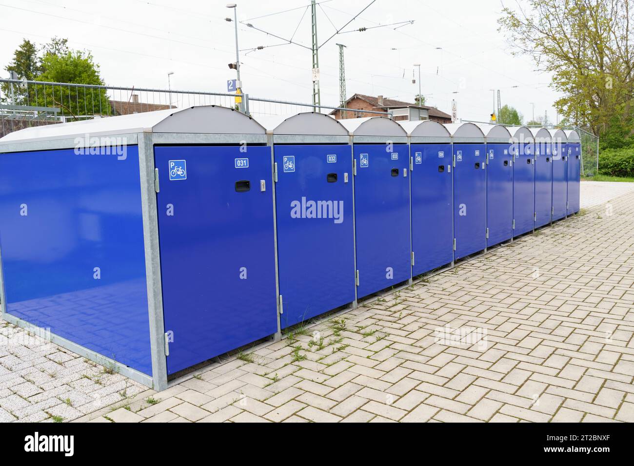 Covered blue boxes for storing bicycles at the railway station Stock ...