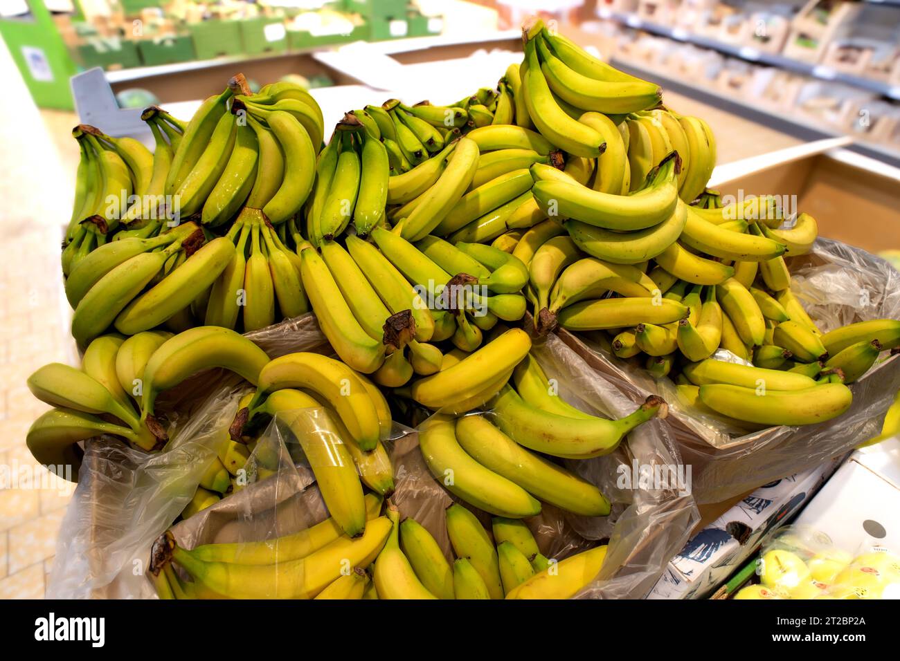 Bunches of bananas displayed on stall for sale in supermarket Stock ...