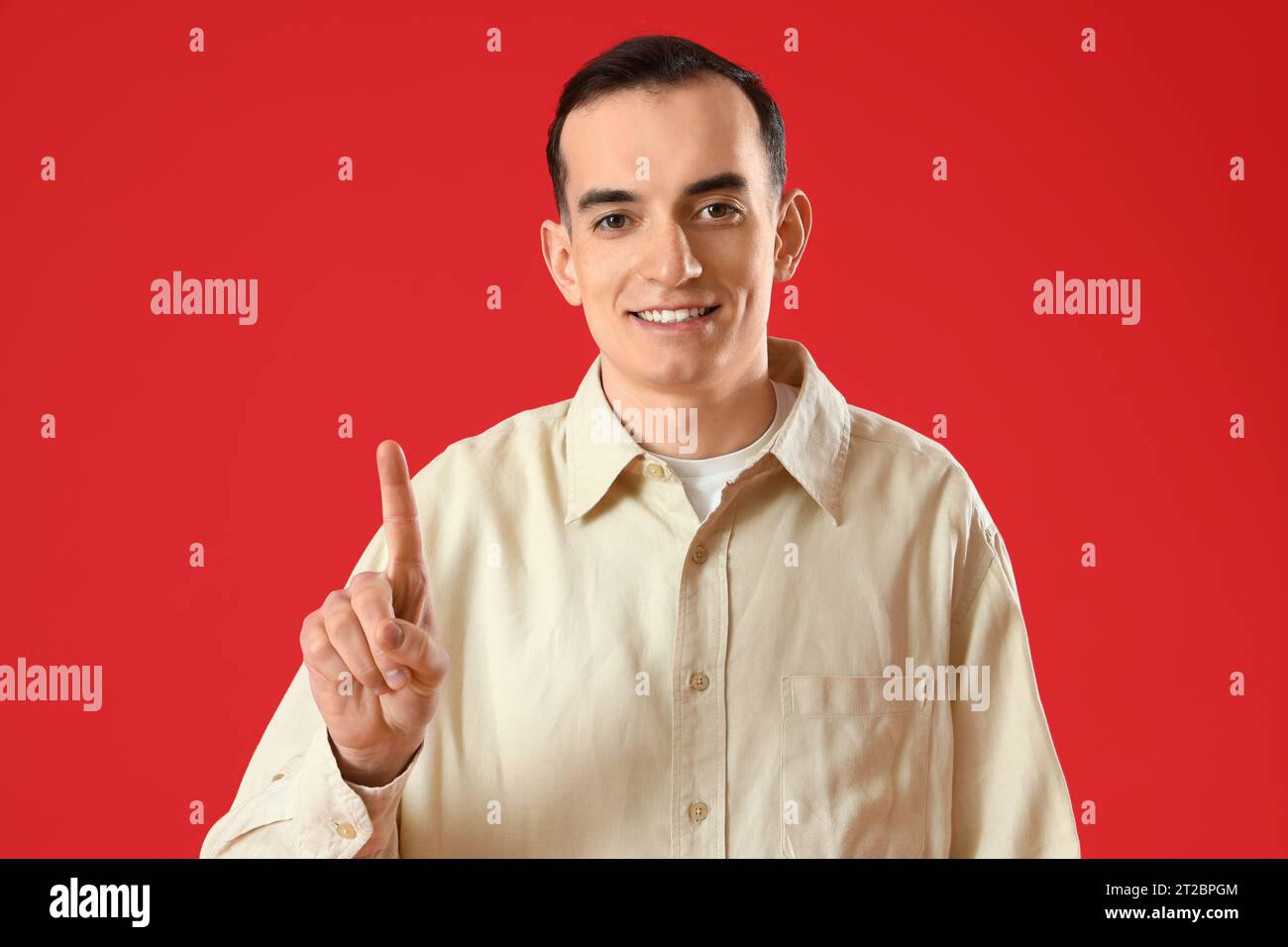Young man showing index hi-res stock photography and images - Alamy