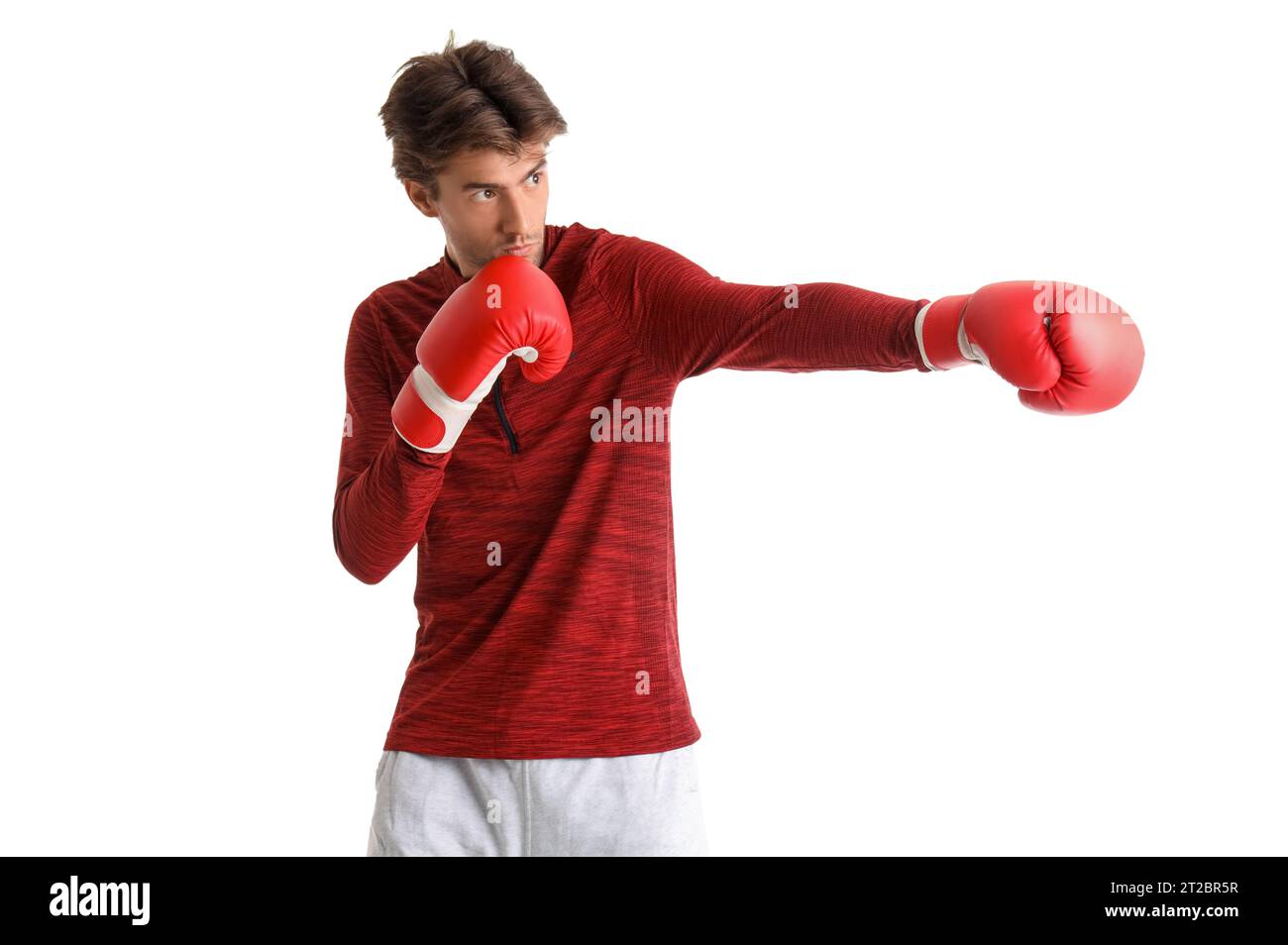 Handsome young man in sportswear boxing on white background Stock Photo ...