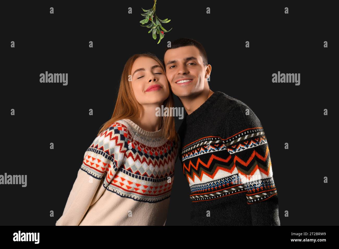 Kissing under the mistletoe portrait hi-res stock photography and ...