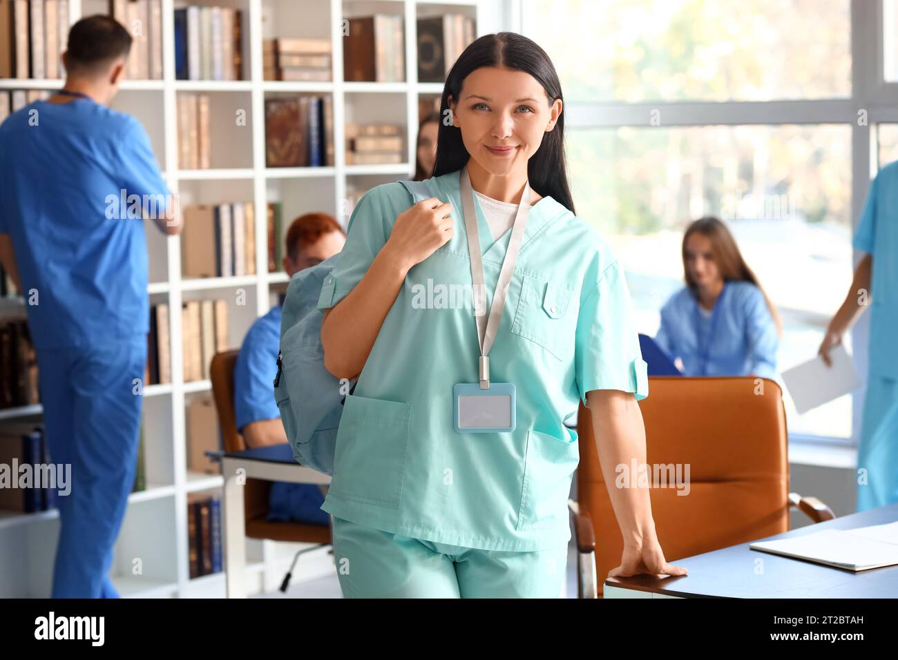 Female medical student in library Stock Photo - Alamy
