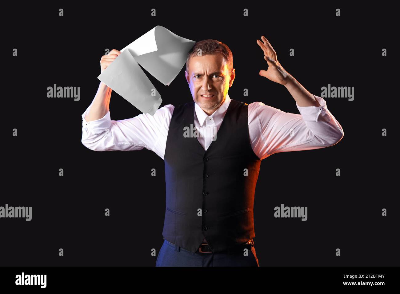 Mature actor with film script on dark background Stock Photo - Alamy