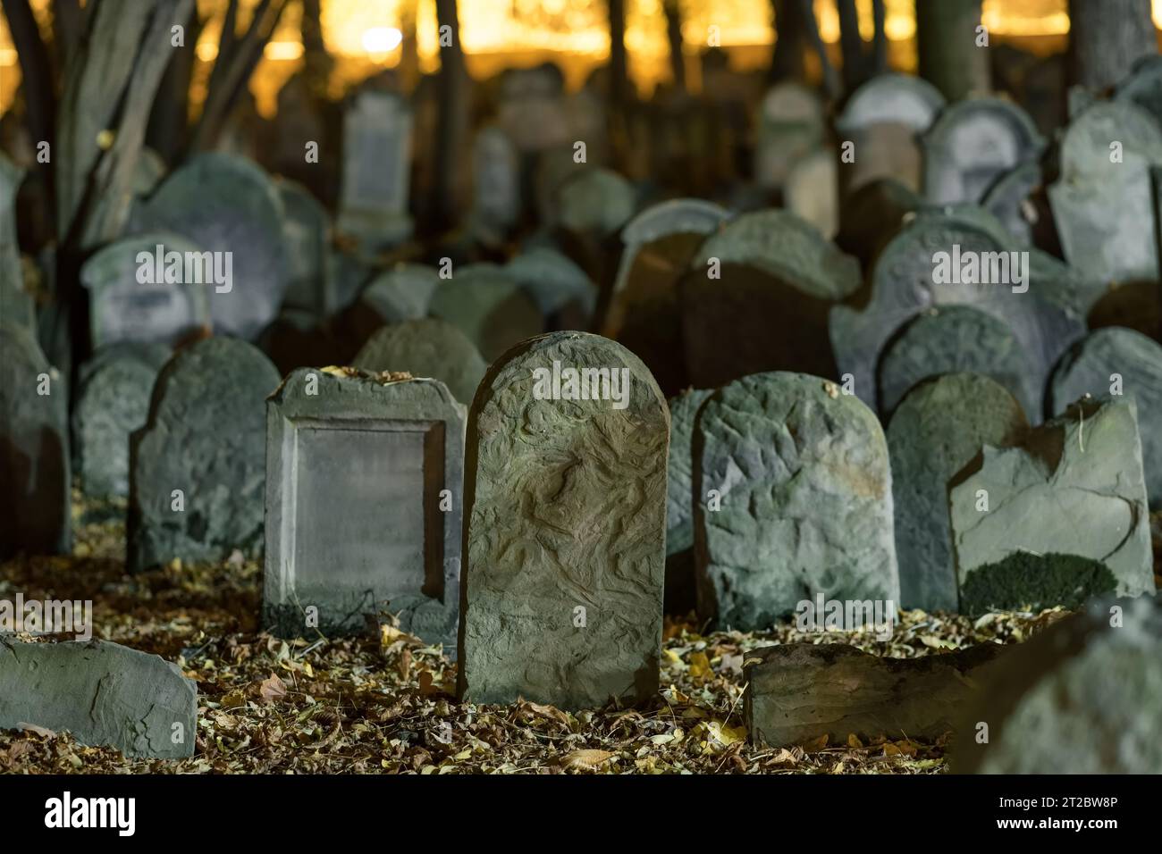 Tombstones in an old cemetery at night Stock Photo - Alamy