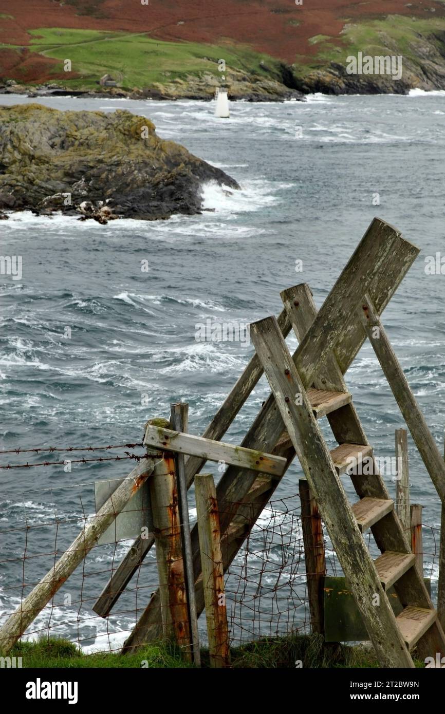 Wooden ladder stile for public footpath overlooking the Calf Sound and ...