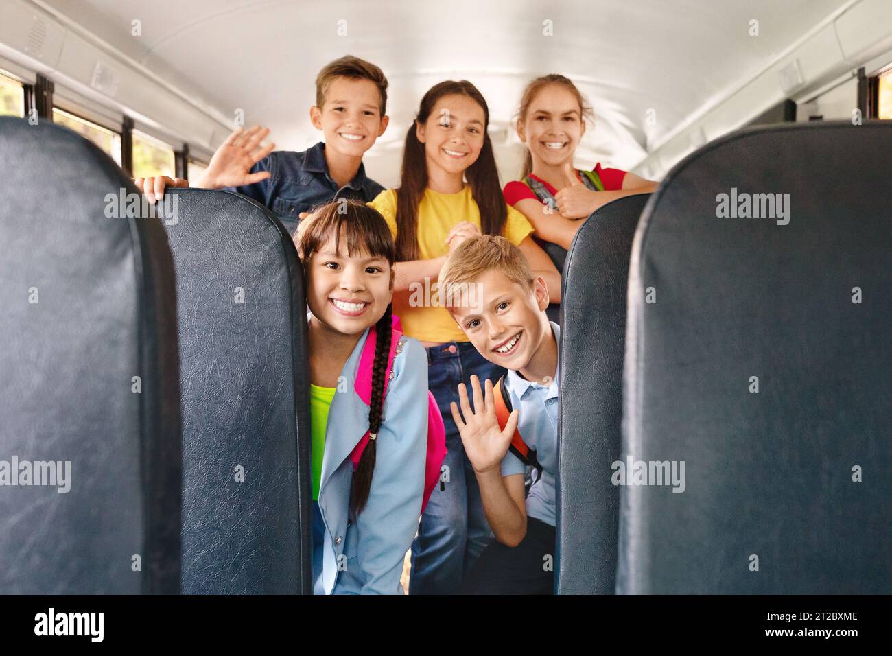 Diverse happy cheerful kids having fun inside a school bus Stock Photo ...