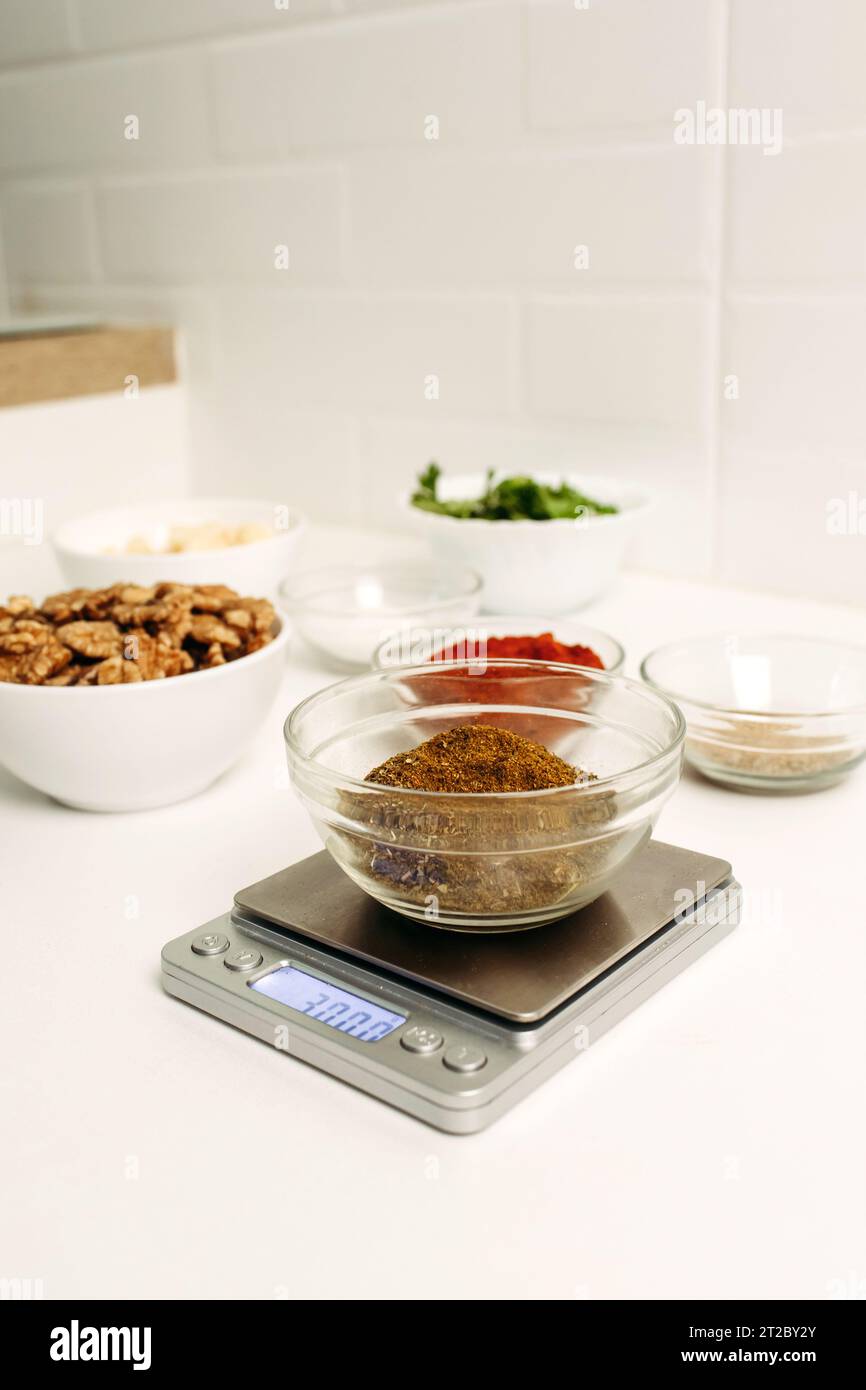 Weighing portions of ingredients to prepare a dish. There is a mixture ...