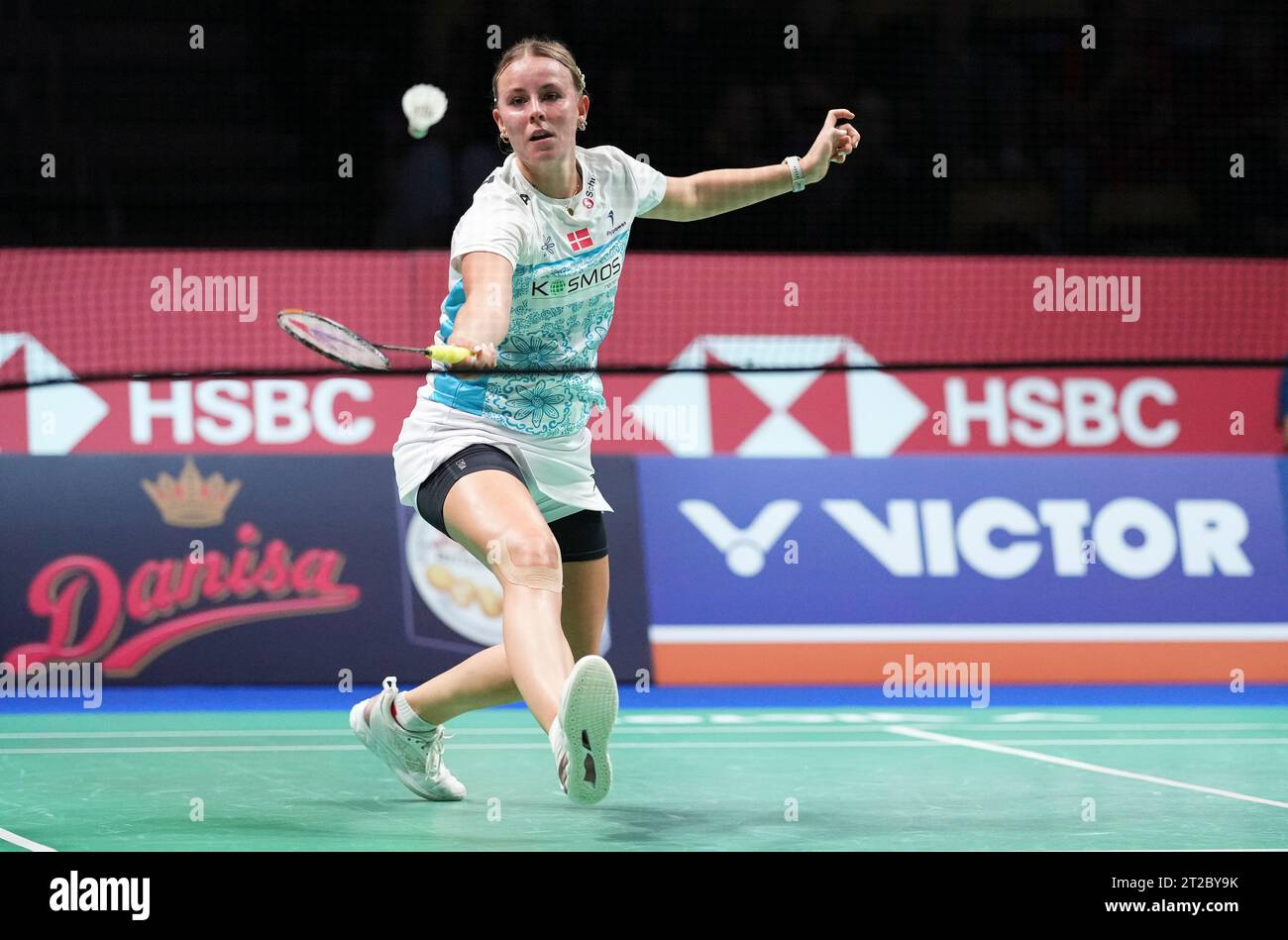Denmark's Mia Blichfeldt returns a shot in the women's singles match ...