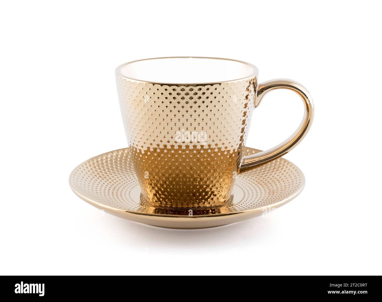 Golden metallic tea cup with saucer isolated on white background with ...
