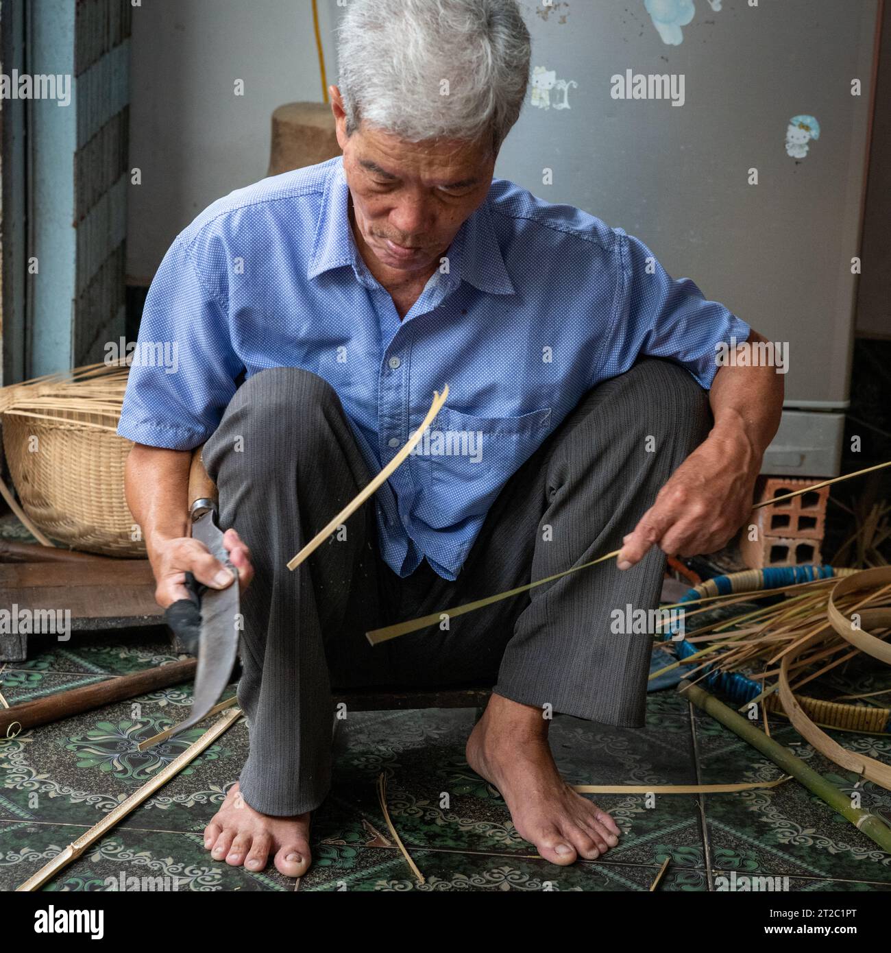 Splitting Bamboo for Weaving Baskets, Mekong Delta, Vietnam Stock Photo ...