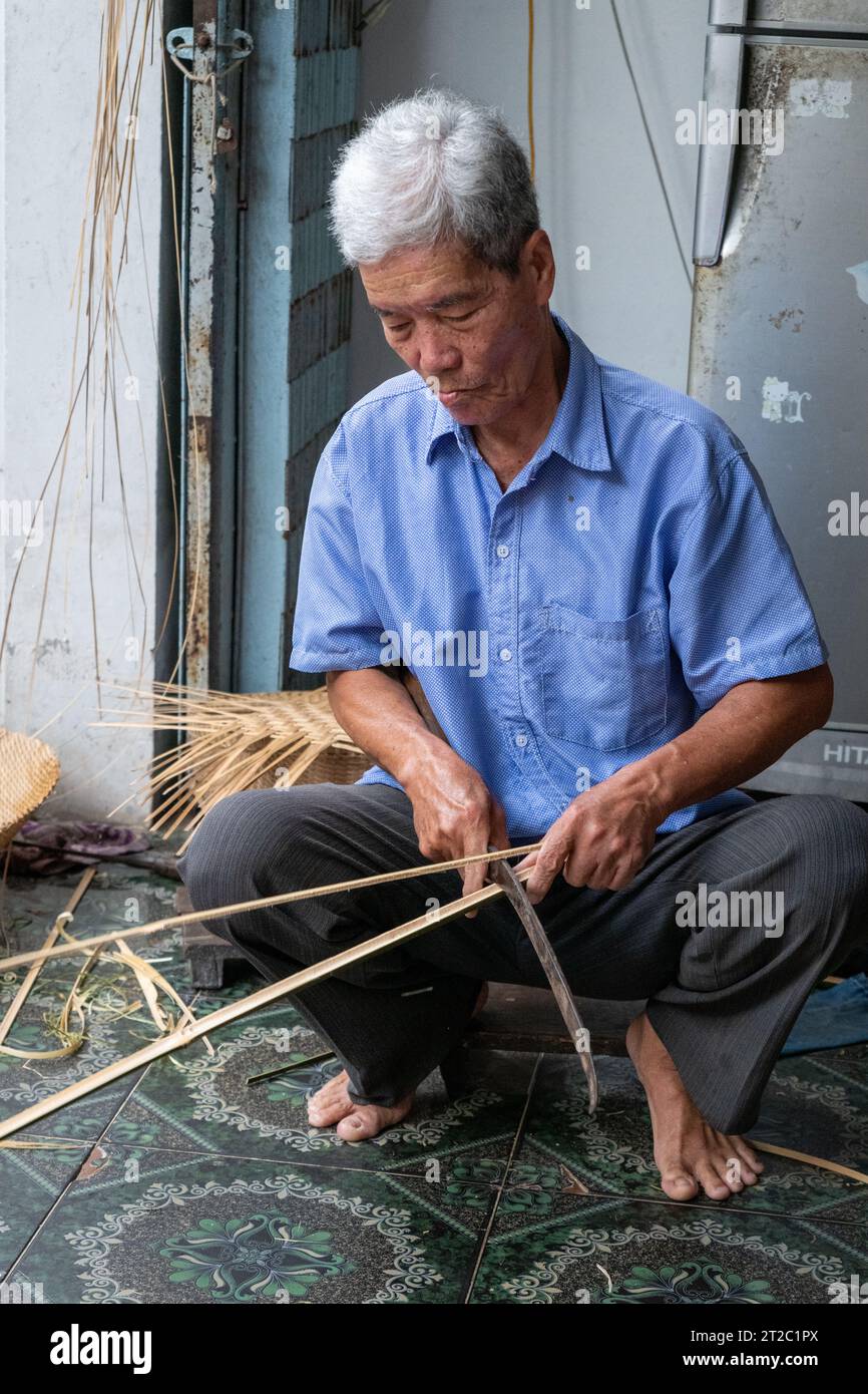 Splitting Bamboo for Weaving Baskets, Mekong Delta, Vietnam Stock Photo ...