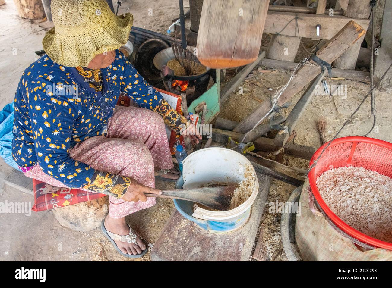Flattening Rice, in Rural Cambodia Stock Photo - Alamy