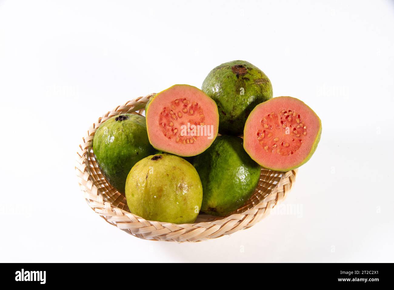 Guava in basket isolated on white background Stock Photo - Alamy