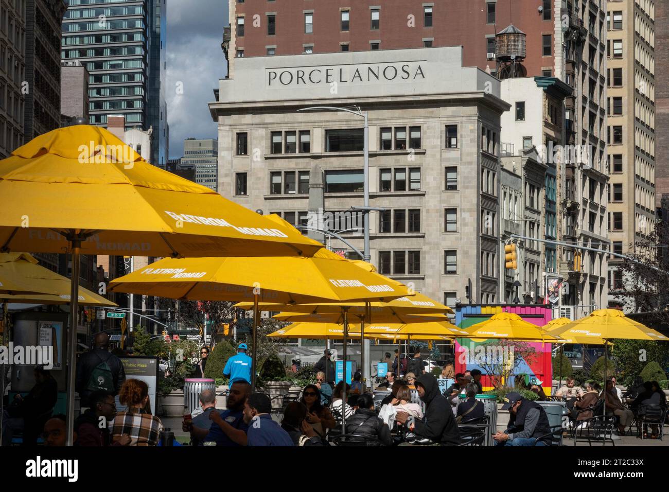 Public space with bright yellow umbrellas at the intersection of Fifth ...