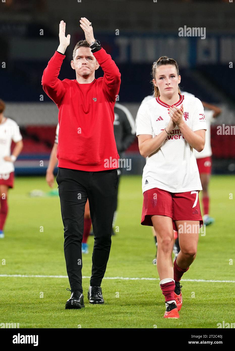 Manchester United manager Marc Skinner (left) and Ella Toone applaud ...