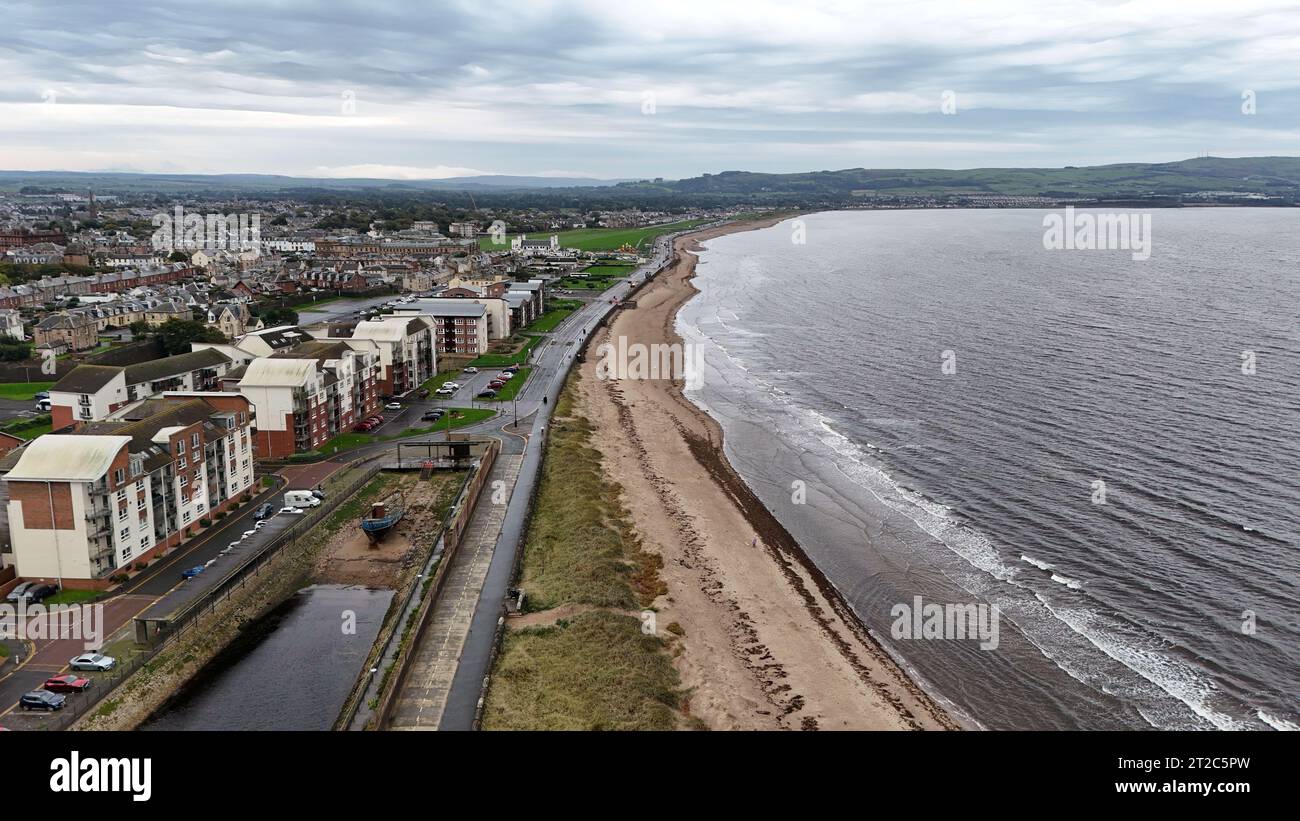 An aerial view of beautiful homes situated on the stunning coastline of ...