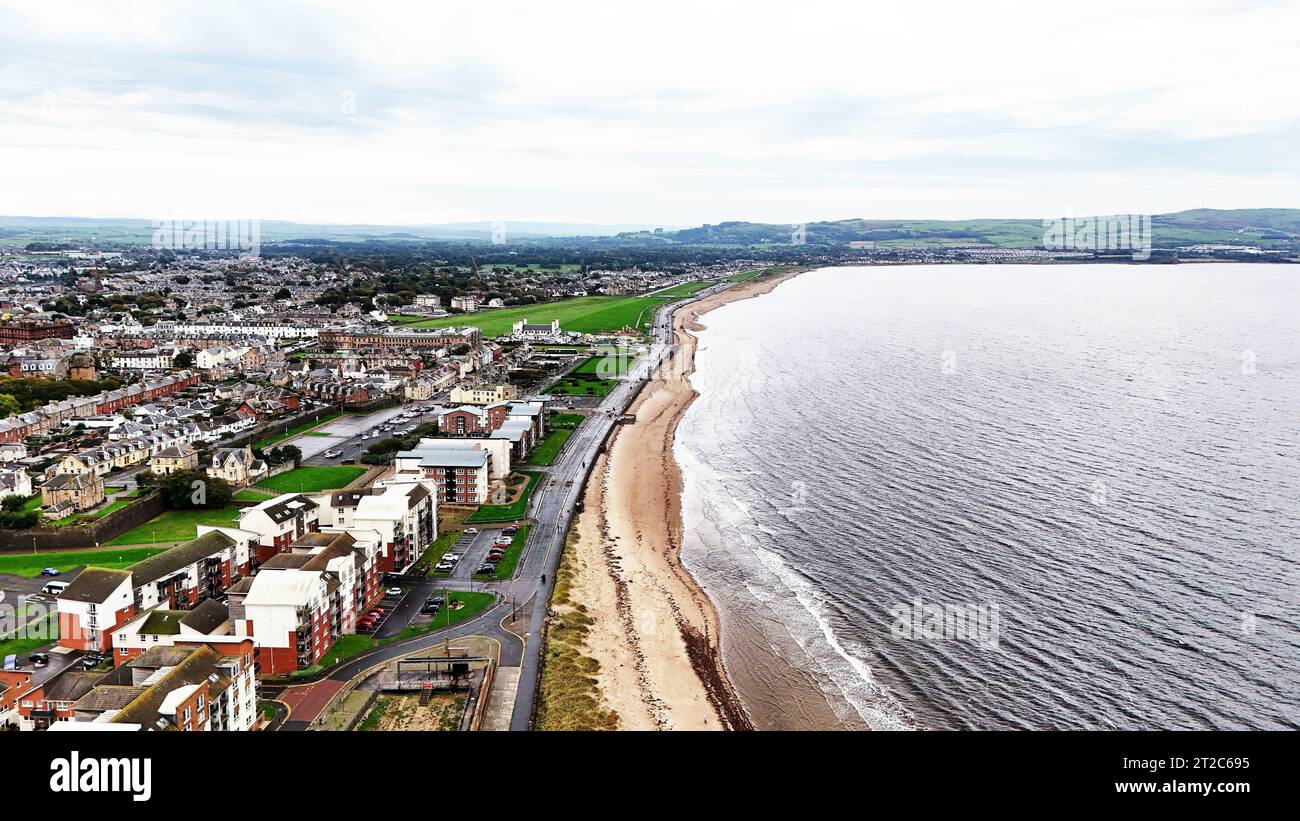 An aerial view of beautiful homes situated on the stunning coastline of ...