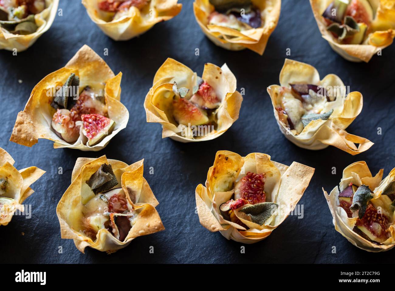 Christmas canapes, filo pastry cups with figs and blue cheese Stock ...