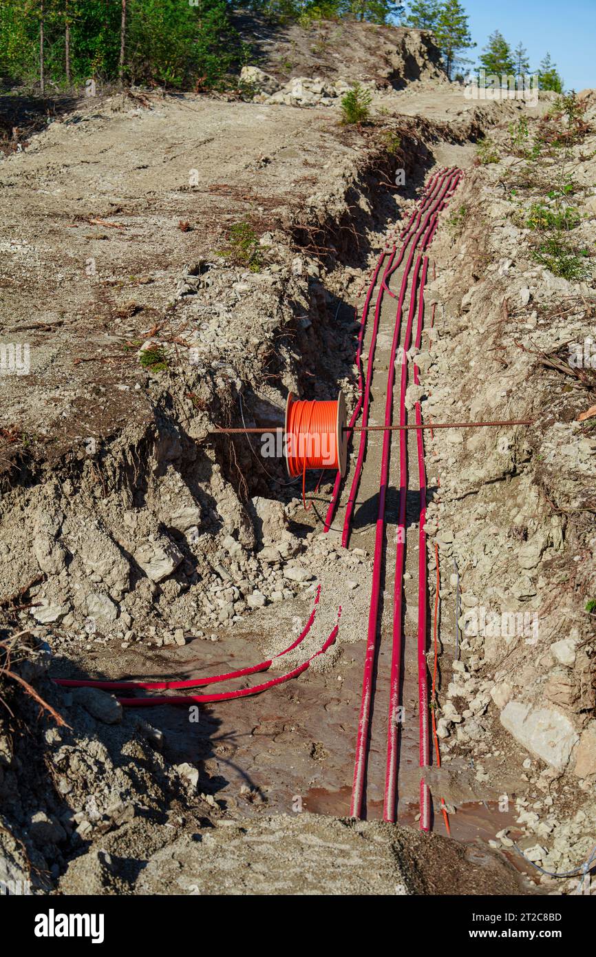 Laying High-Voltage Cables Underground Through the Forest to Connect ...