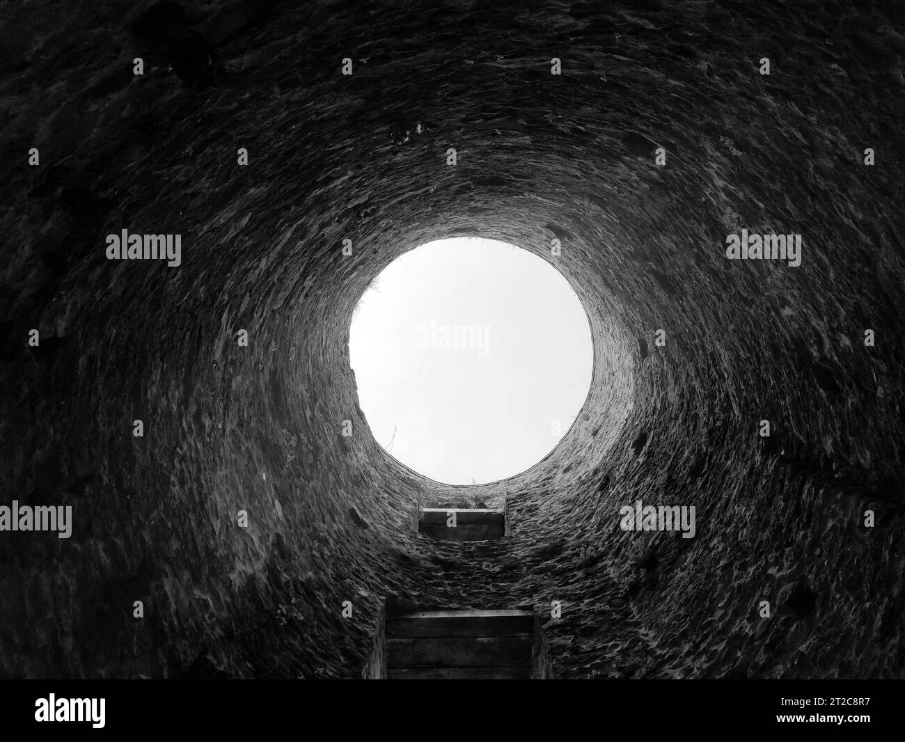 Stone well hole, old construction from inside, fall down in the well ...