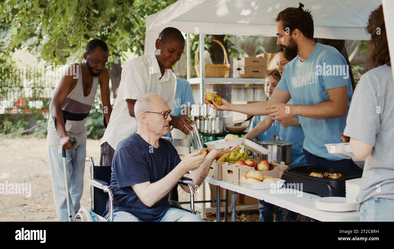 Man woman in wheelchair feeding hi-res stock photography and images - Alamy