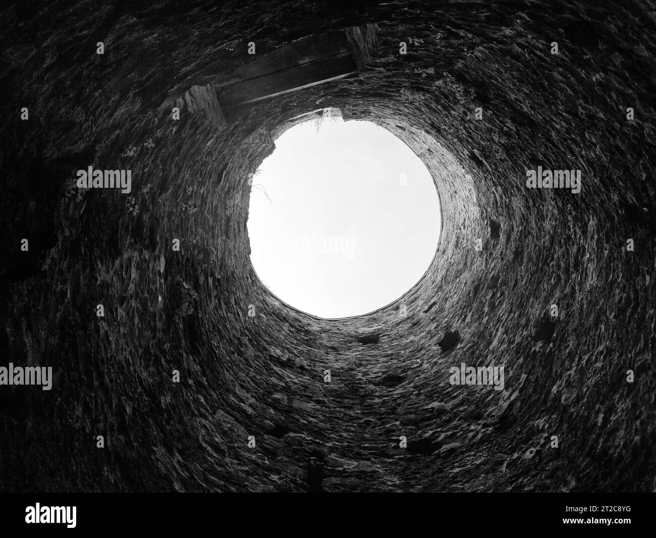Stone well hole, old construction from inside, fall down in the well ...
