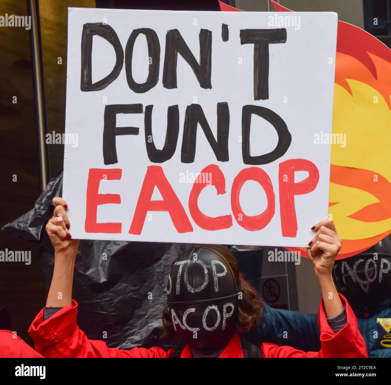 London, UK. 18th Oct, 2023. A protester wearing a 'Stop EACOP' mask ...