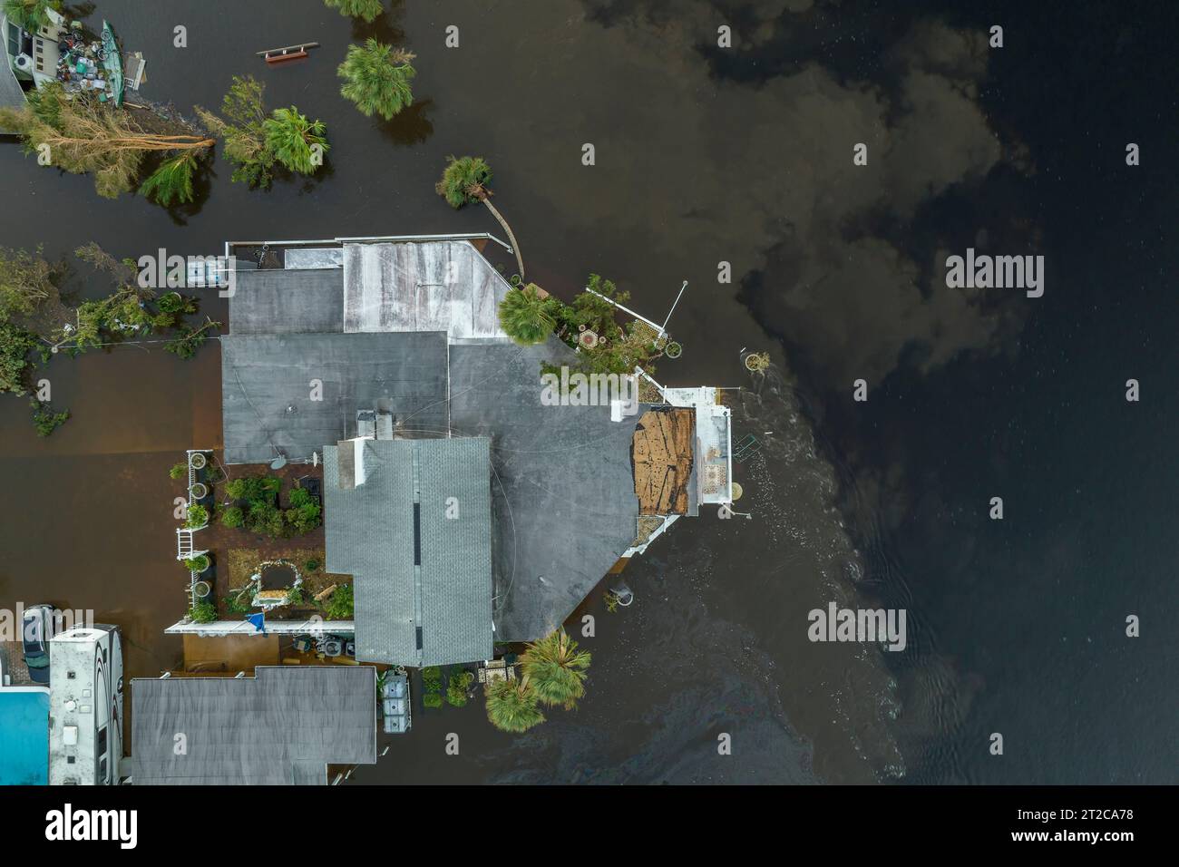 Aftermath of natural disaster. Flooded houses by hurricane Ian rainfall ...