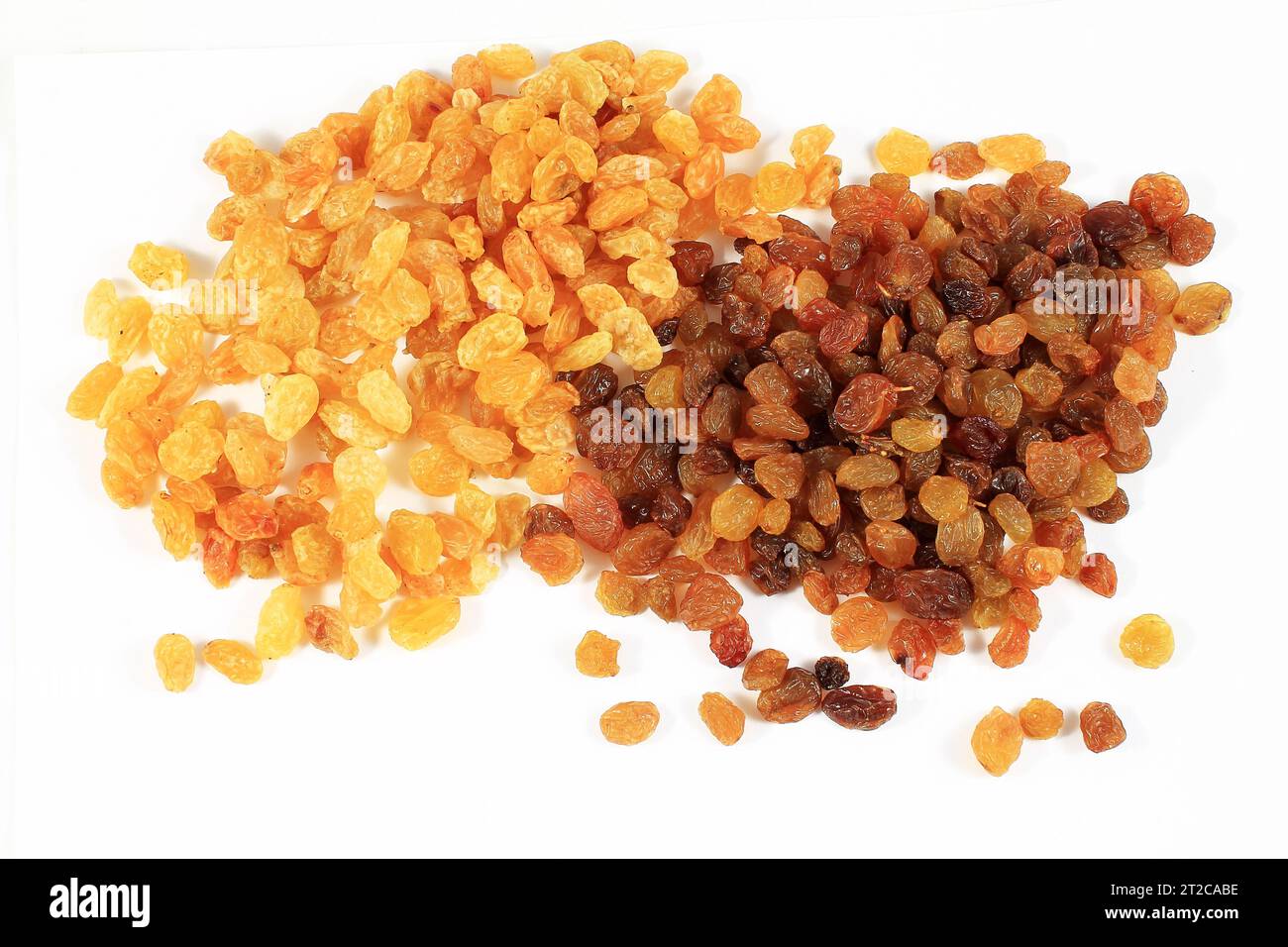 Dried raisins of different size on a white background Stock Photo - Alamy