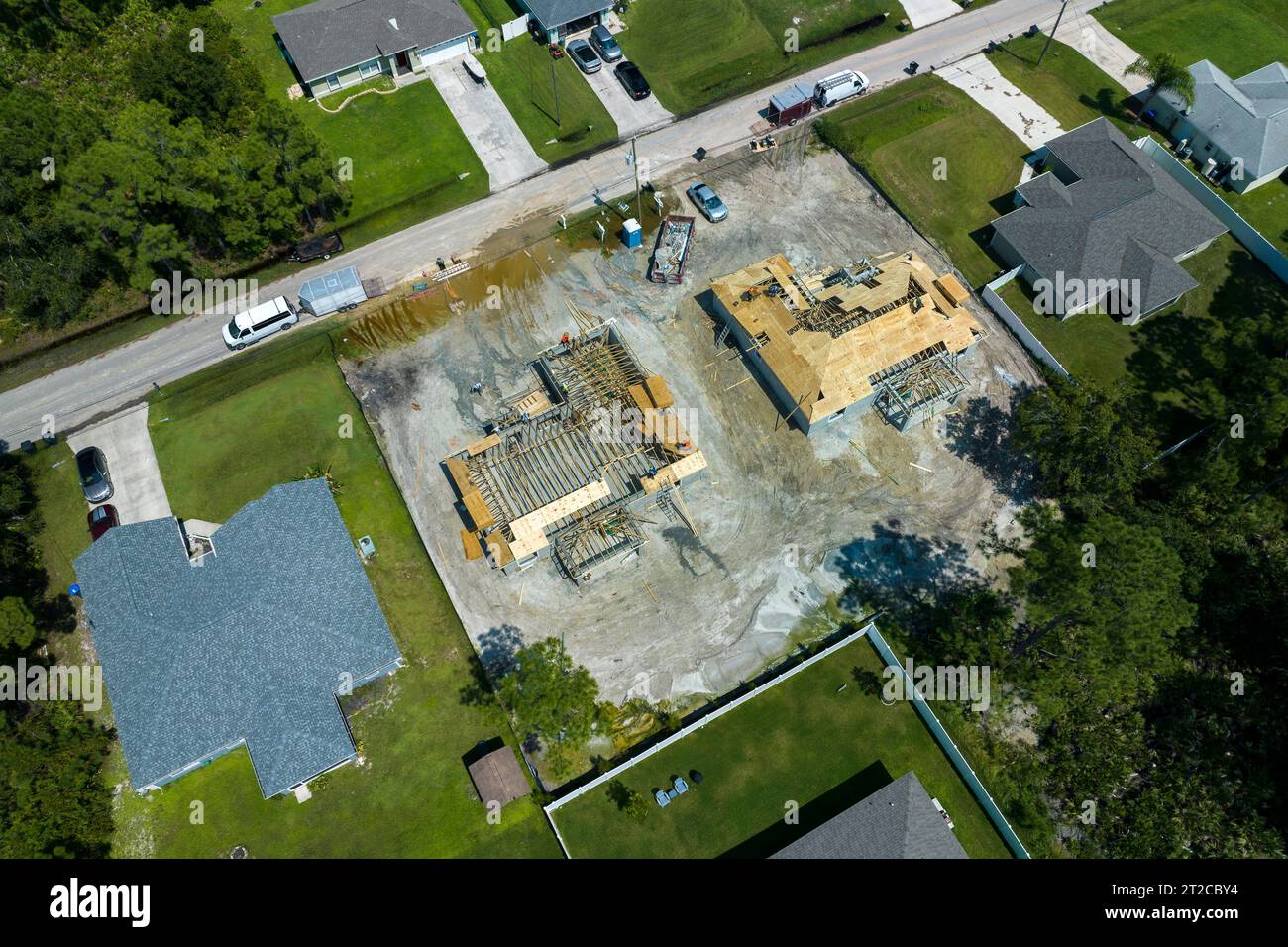 Professional builders working on roof construction of unfinished ...