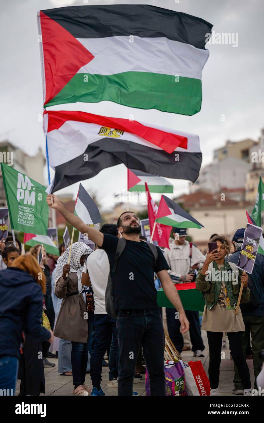 Lisbon, Portugal. 18th Oct, 2023. An activist is seen carrying Palestinian and Egyptian flags ...