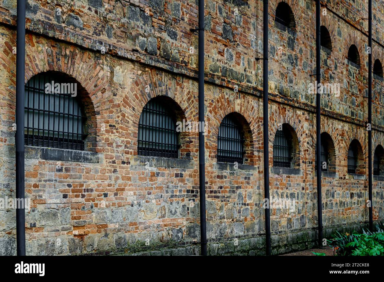 Old prison windows with brick walls Stock Photo - Alamy