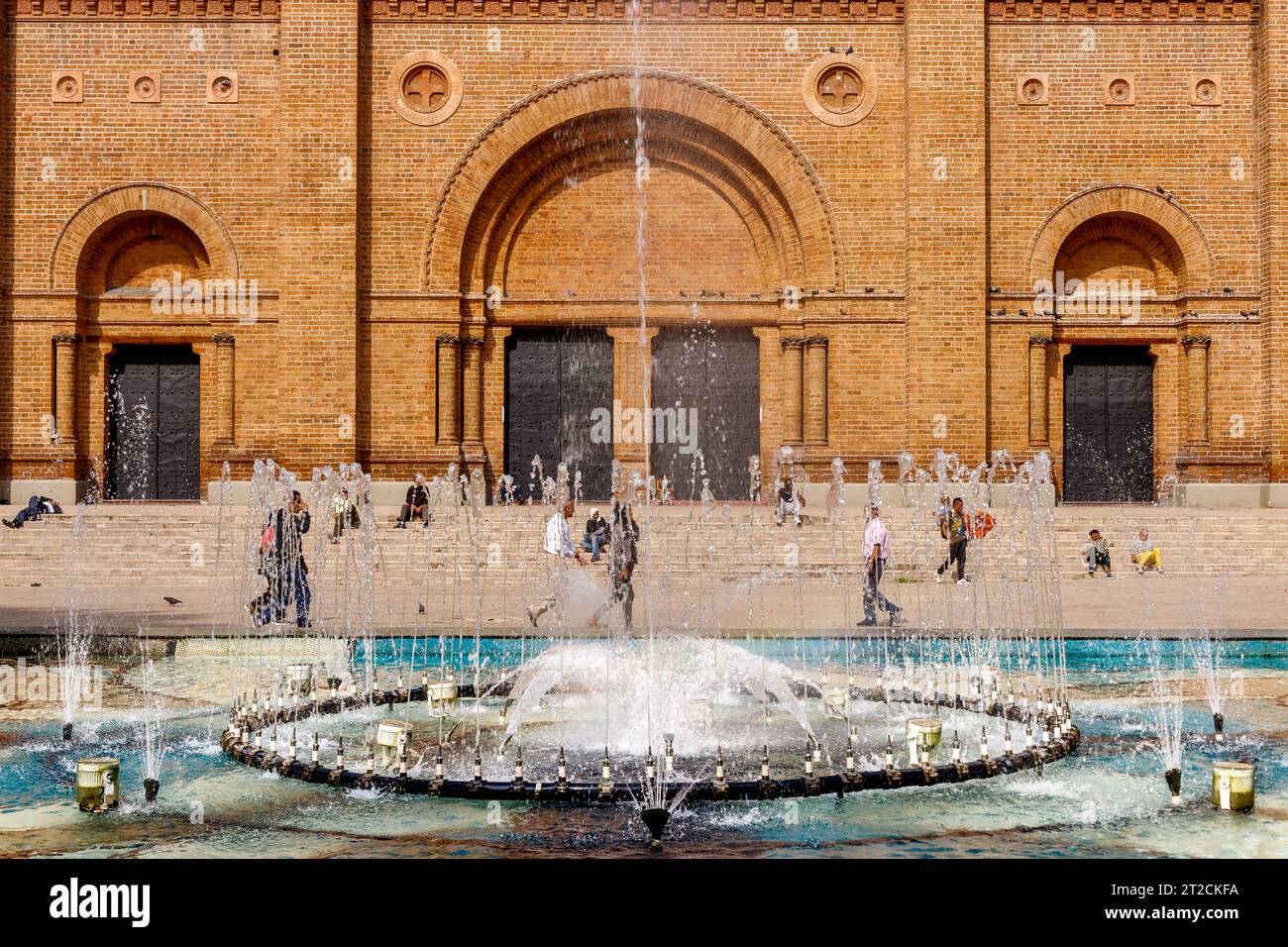Medellin, Colombia - January 10, 2023: People, seen through the water ...