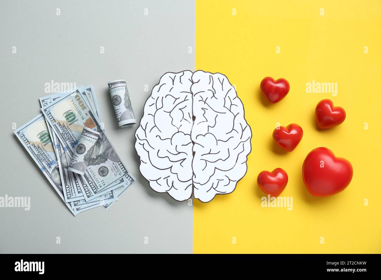 Emotional and rational. Paper human brain, dollar banknotes and red ...