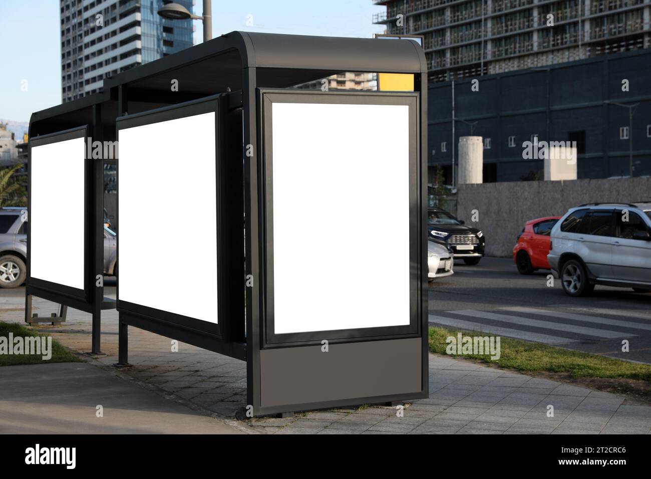 Bus stop with empty signboards in city. Mock-up for design Stock Photo ...