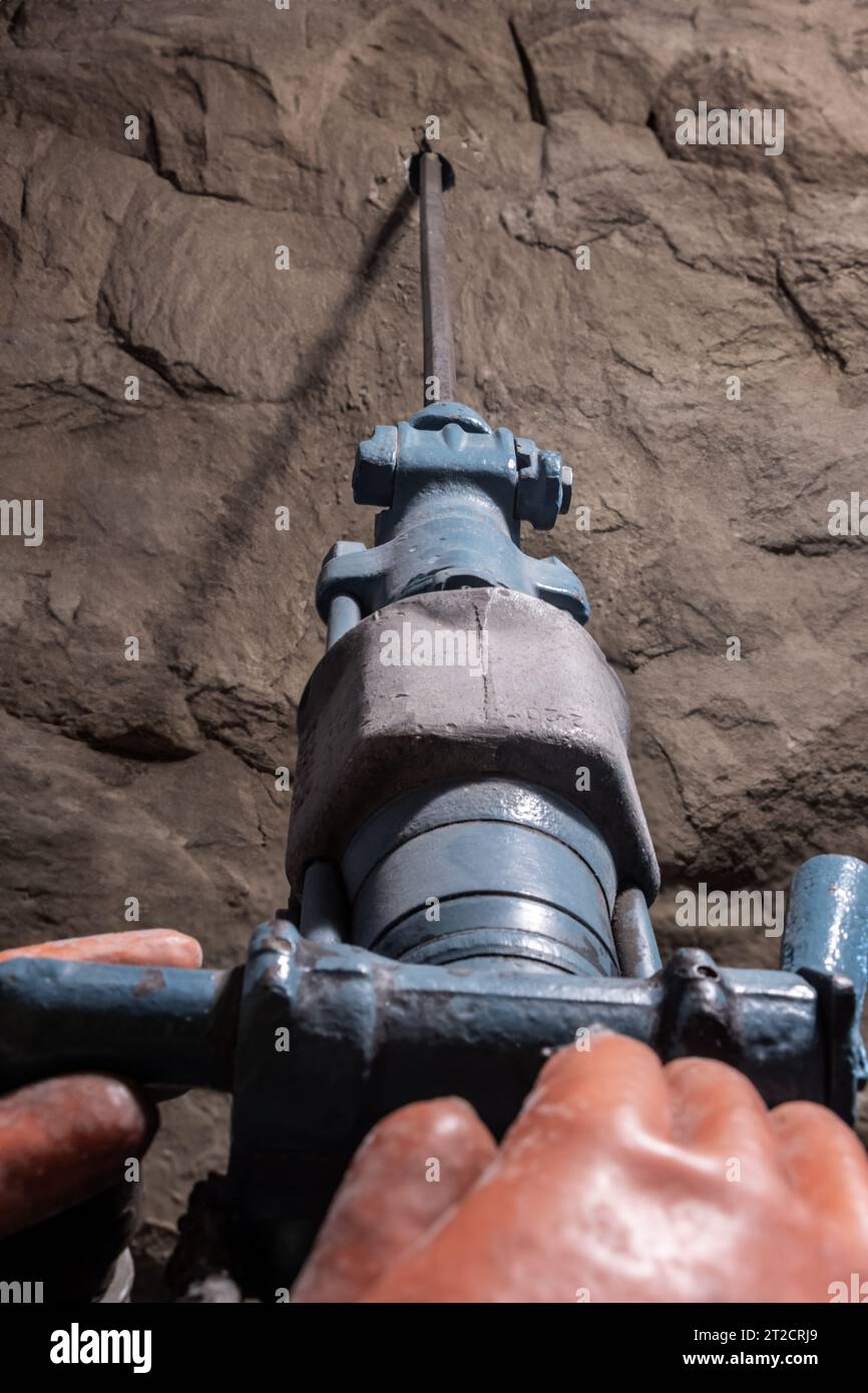 First person view - miner working with jackhammer in mine Stock Photo ...