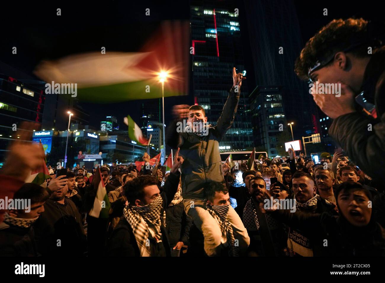 People gather outside the Israeli consulate during a protest to show ...